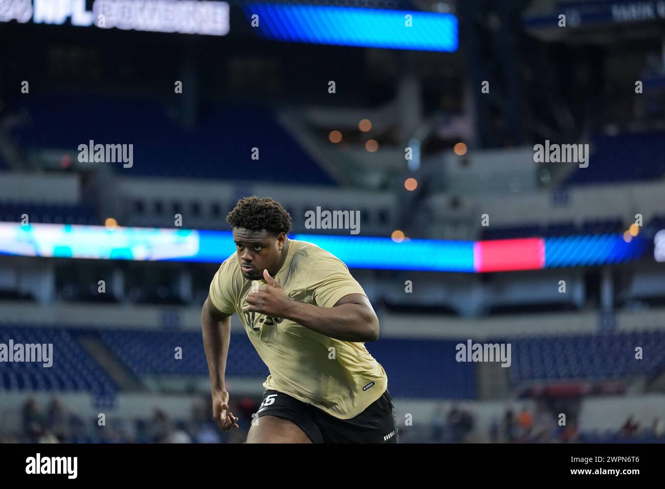 Texas offensive lineman Christian Jones runs a drill at the NFL ...