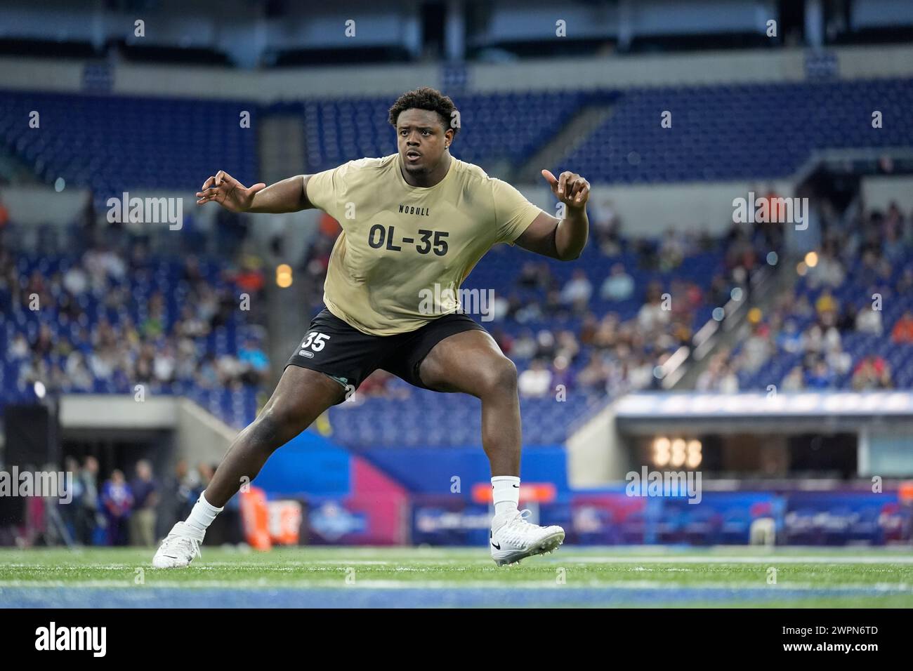Texas offensive lineman Christian Jones runs a drill at the NFL ...