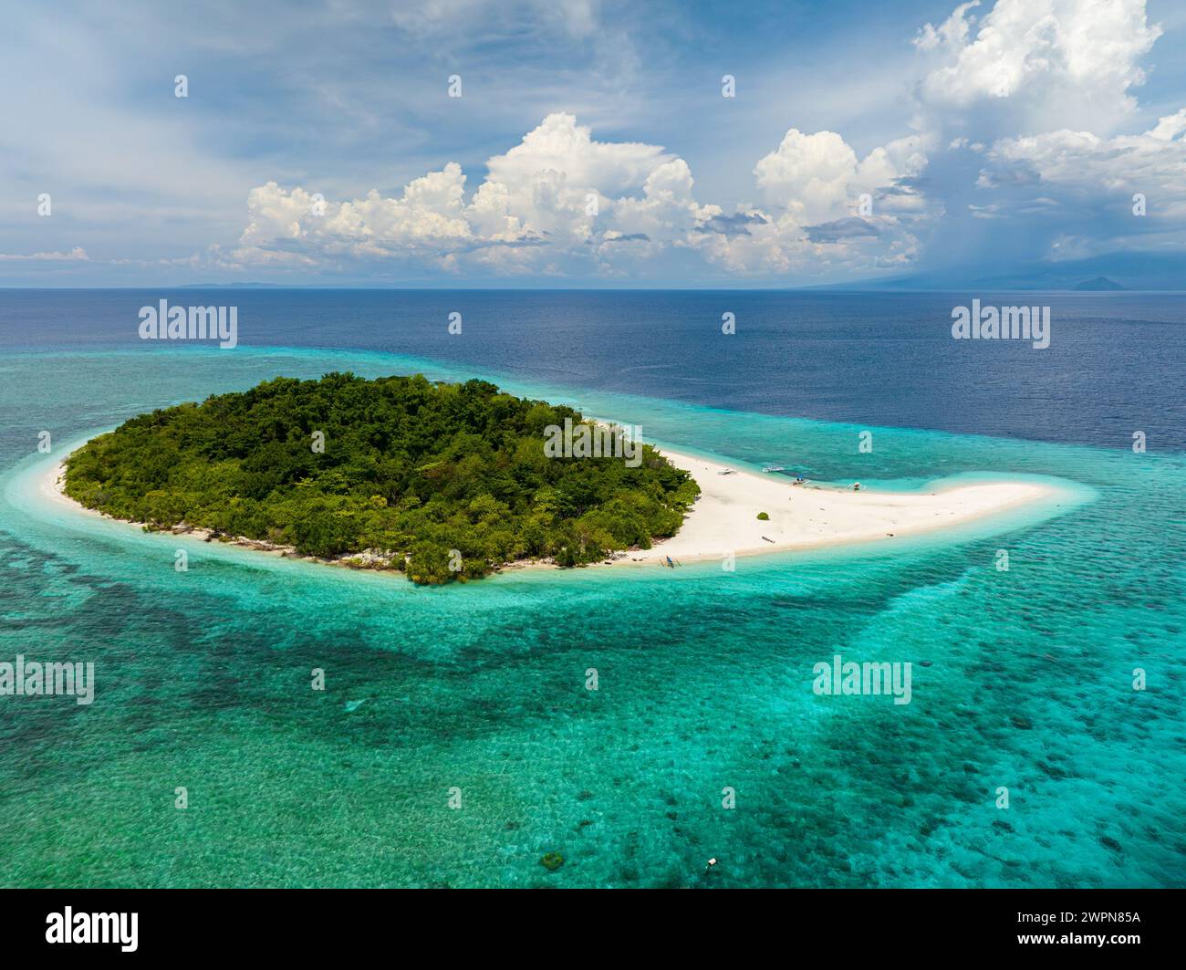 Beautiful beaches in Mantigue Island. Blue sky and clouds. Camiguin ...