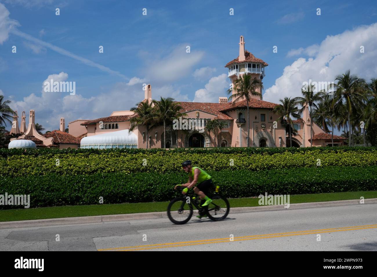 A cyclist passes Mar-a-Lago, as former President Donald Trump is ...