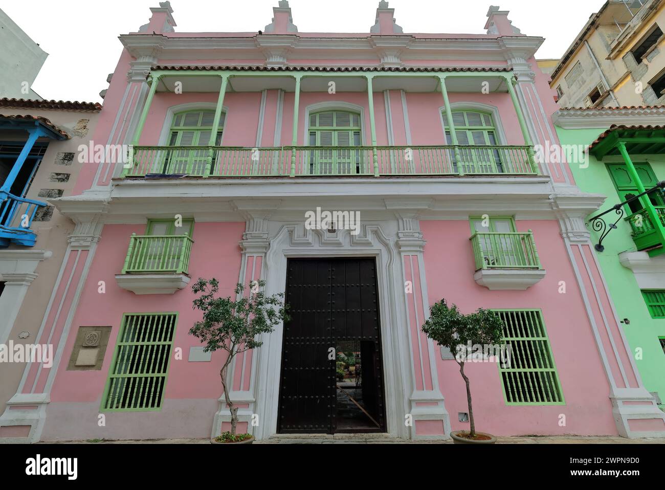 055 Pink, mint green and white facade of colonial building rebuilt in ...