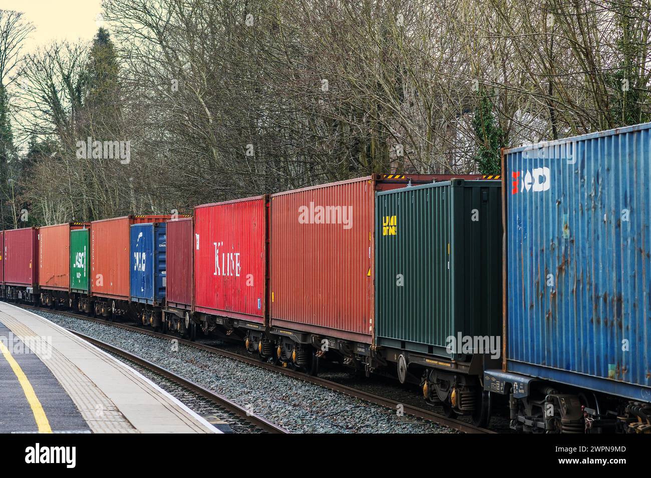Afreight train is passing through Dorridge station west midlands ...