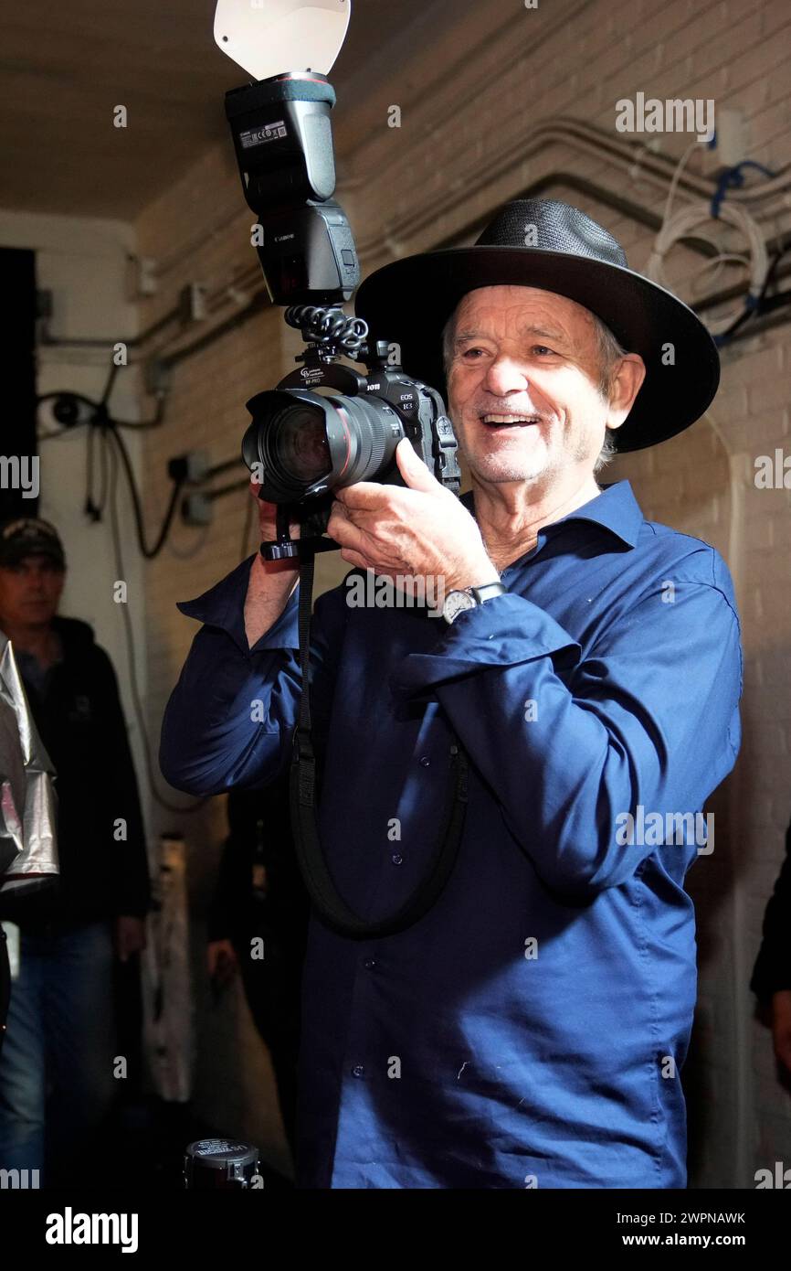 Bill Murray borrows a photographer's camera during arrivals for the 8th ...