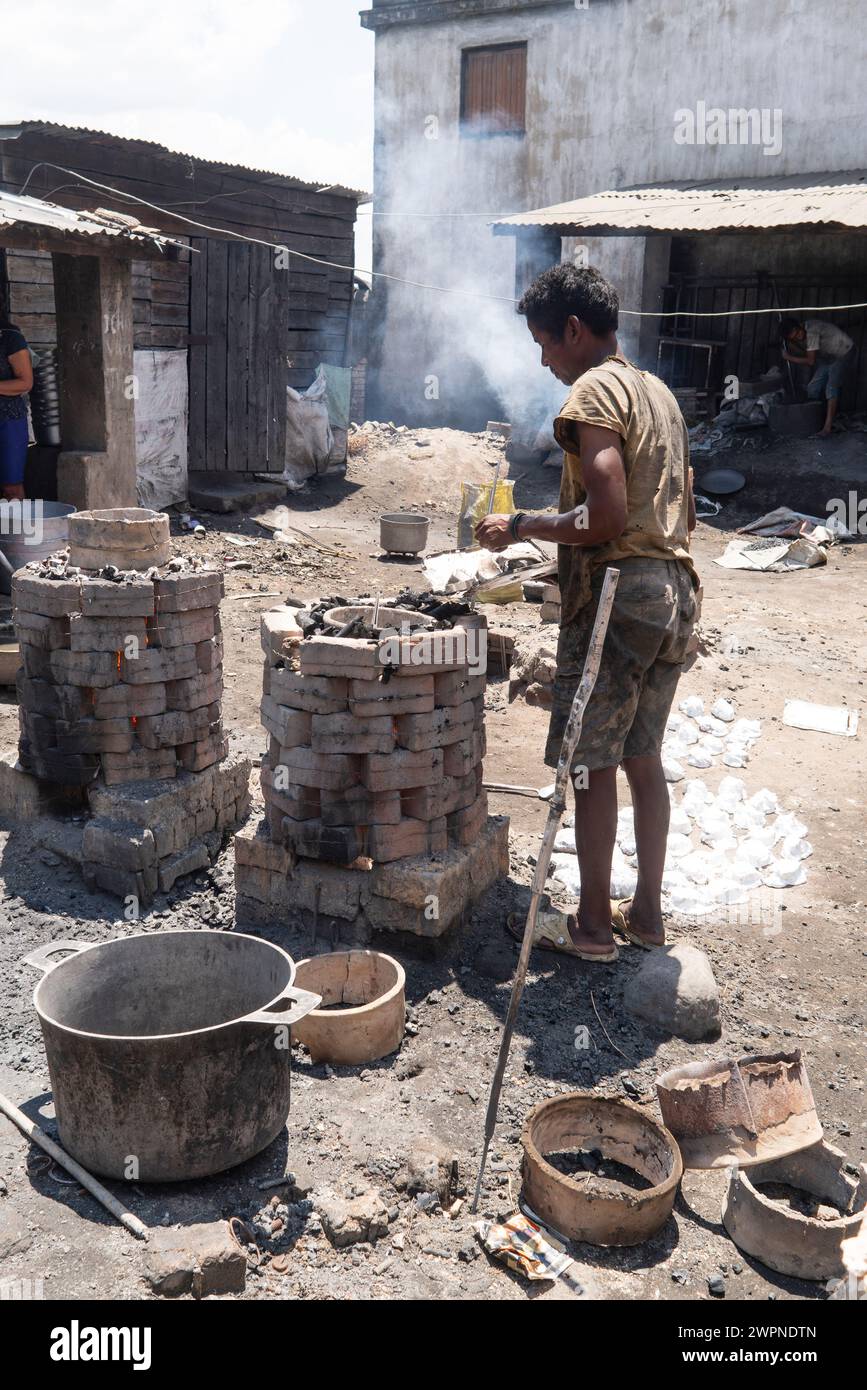 Melting scrap aluminium in an aluminium recycling factory, Ambatolampy ...