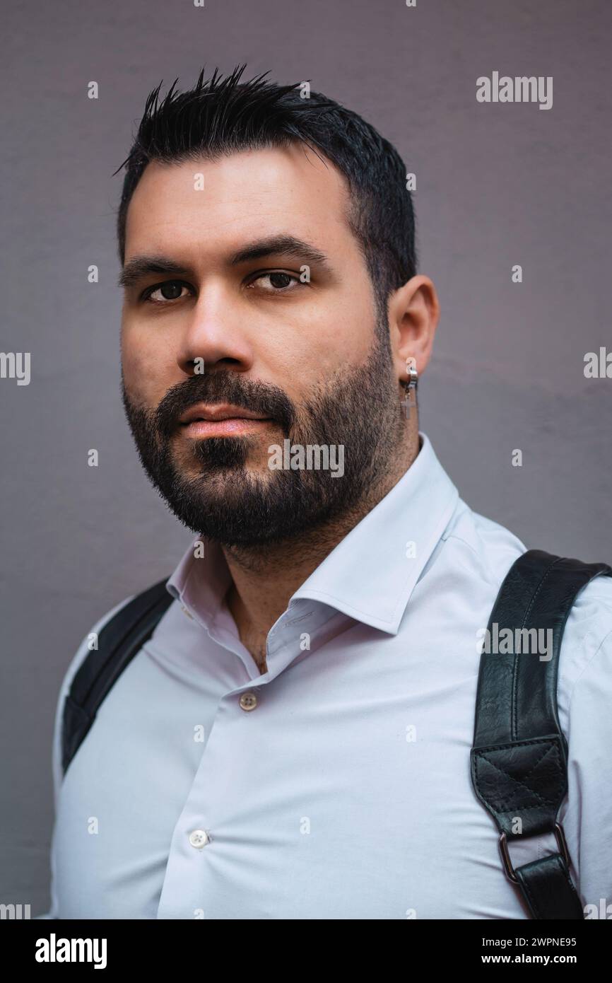 Confident professional man wearing a crisp white shirt and leather bag ...