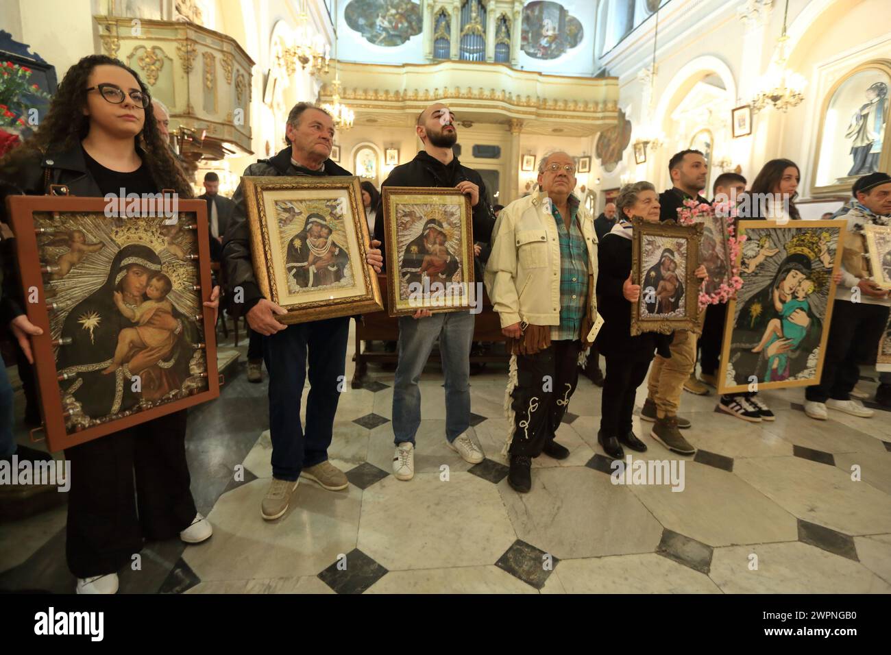 Pagani, Salerno, Italy. 07th Mar, 2024. Faithful seen with a painting ...