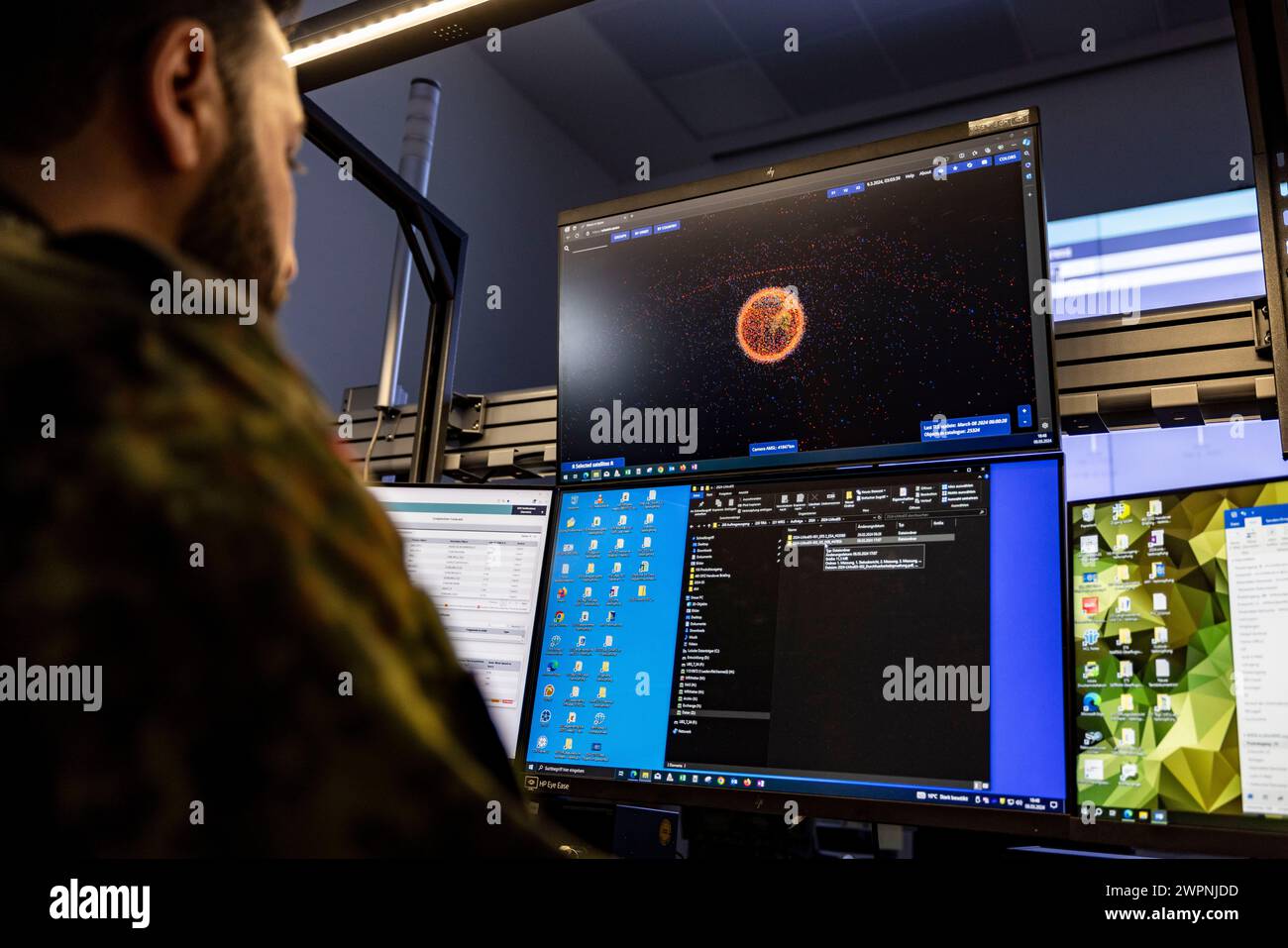 Uedem, Germany. 08th Mar, 2024. A Bundeswehr soldier sits in front of ...