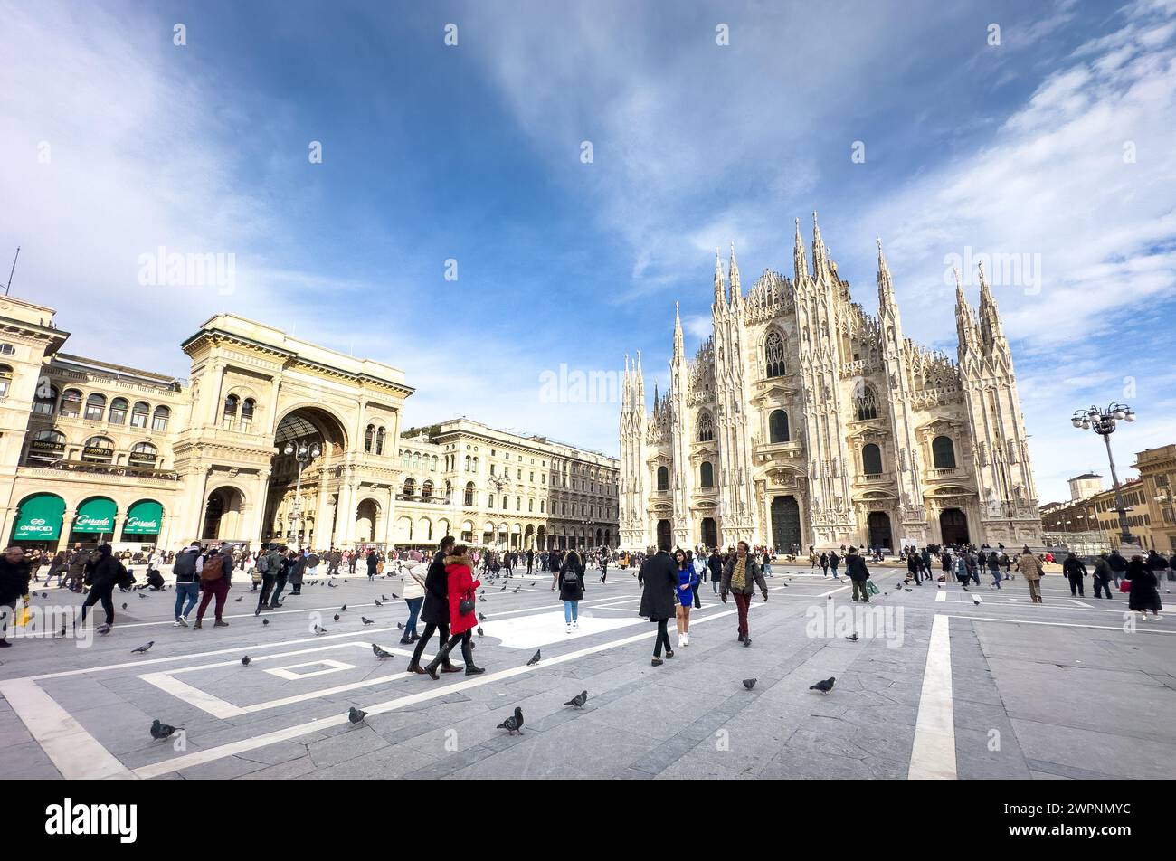 People walk in the Piazza del Duomo in front of the Duomo di Milano ...