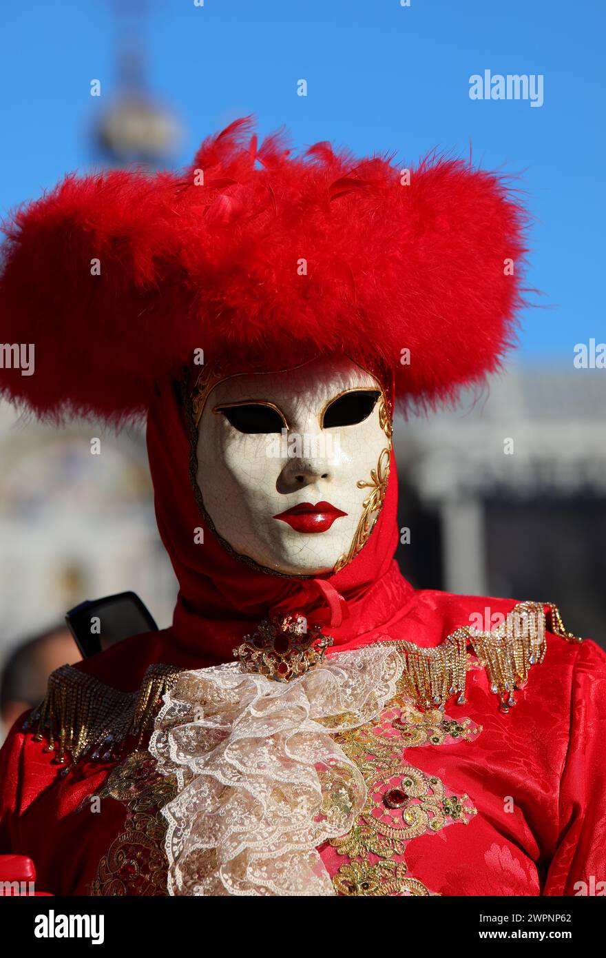Masked person with big red hat on the head and with mask Stock Photo ...