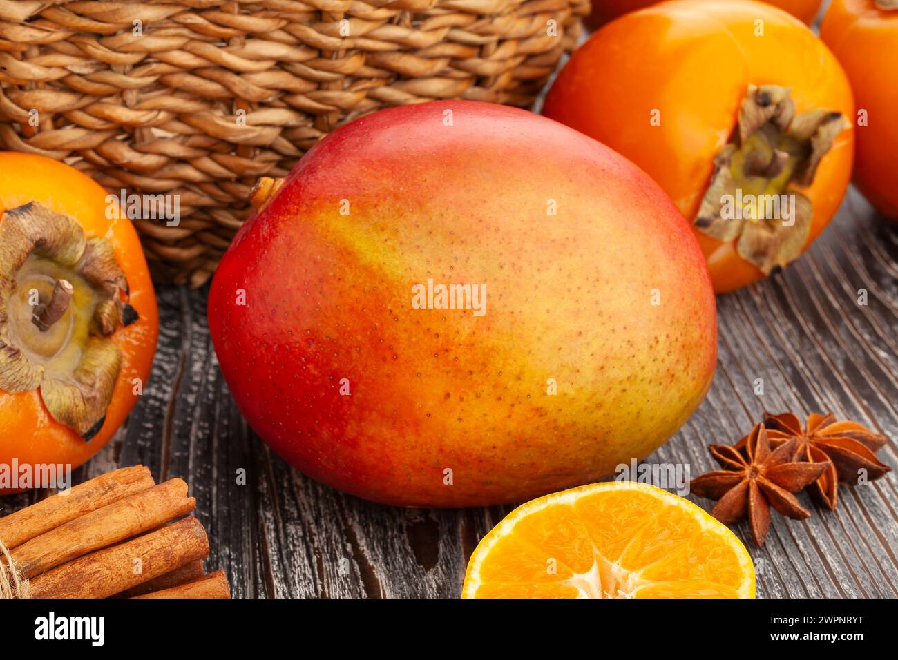one mango on wood background Stock Photo - Alamy