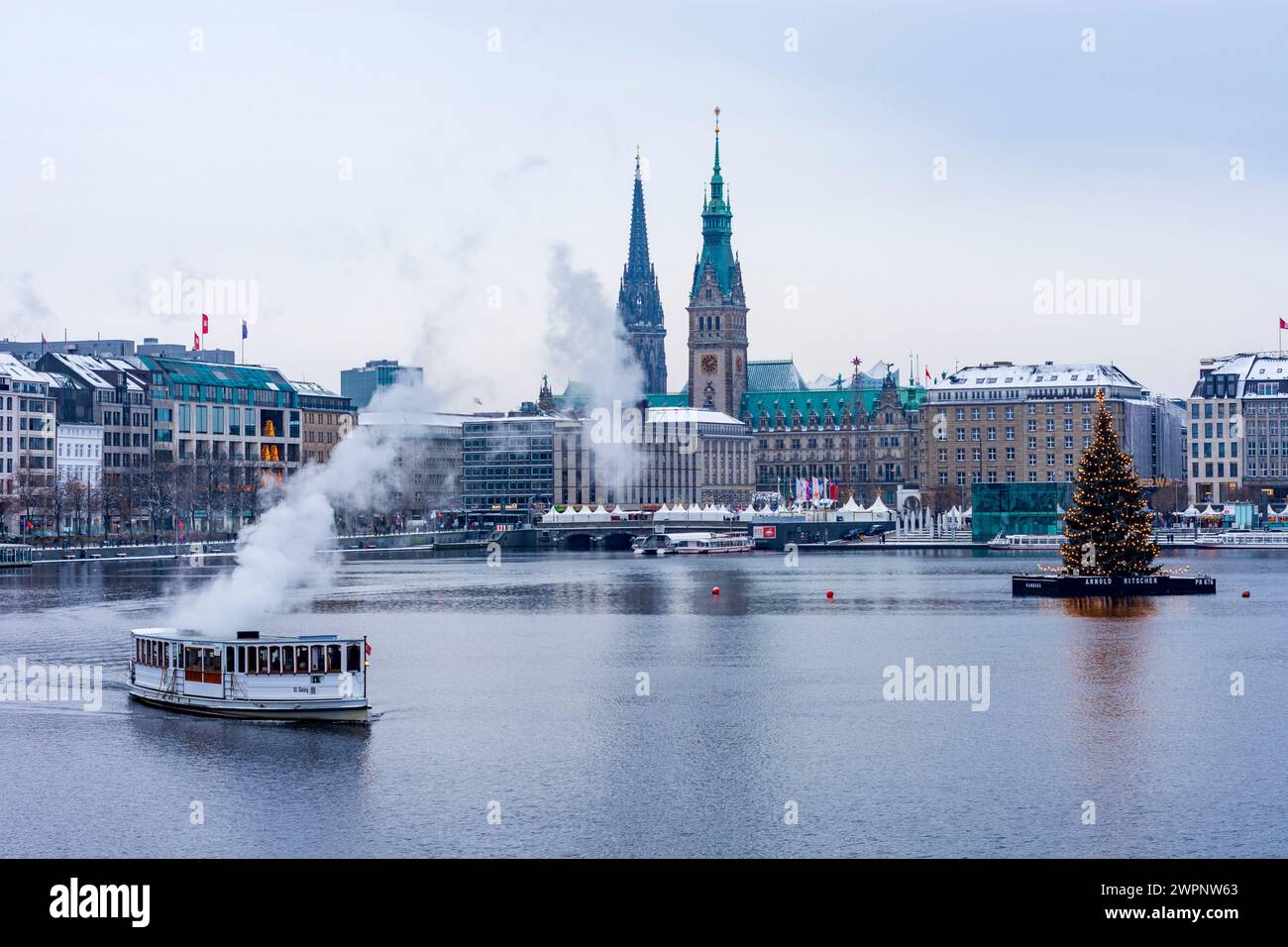 Hamburg, lake Binnenalster, towers of church Sankt Nikolai and Town ...