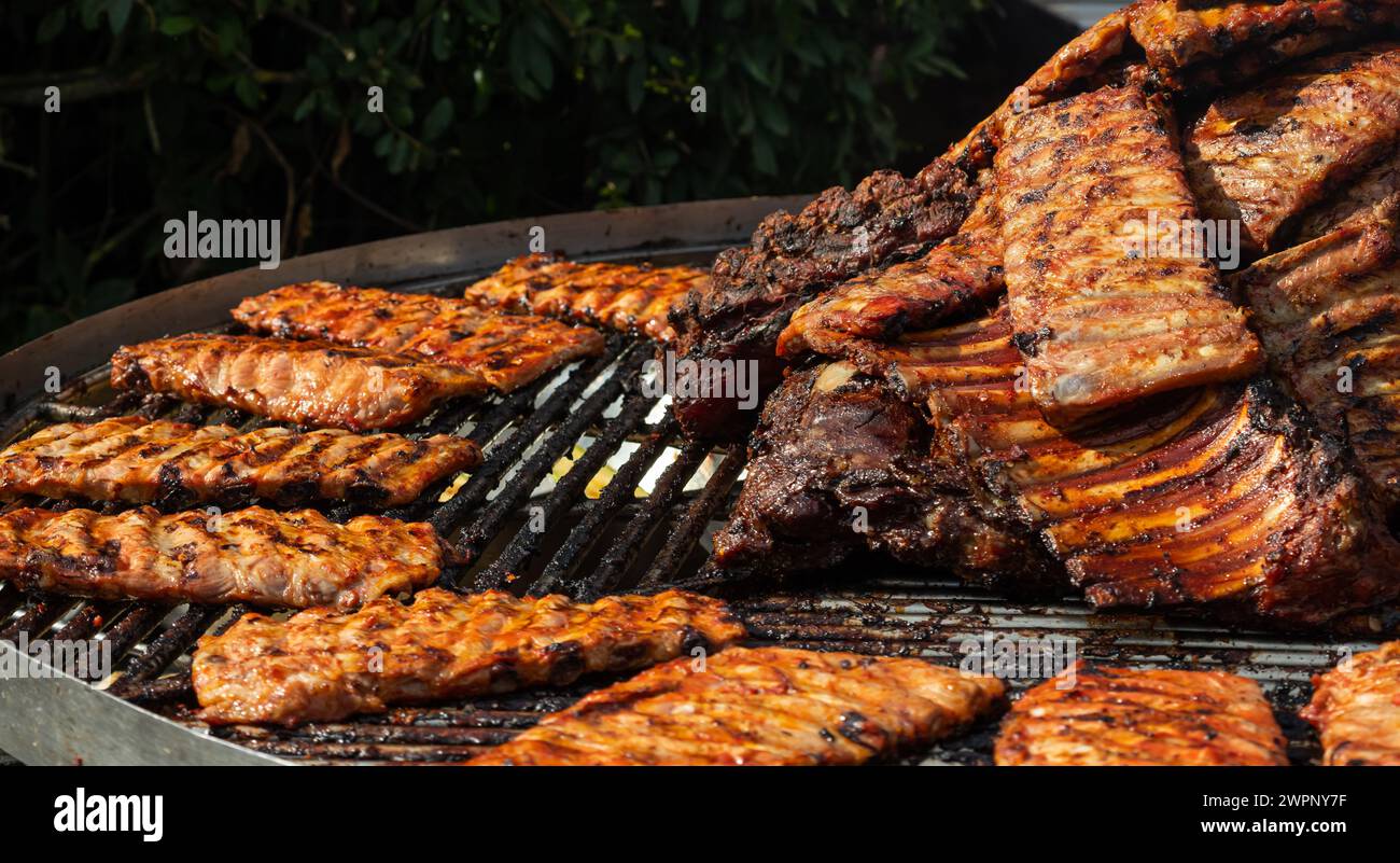 The pork ribs grilling with bbq glaze street food Stock Photo - Alamy