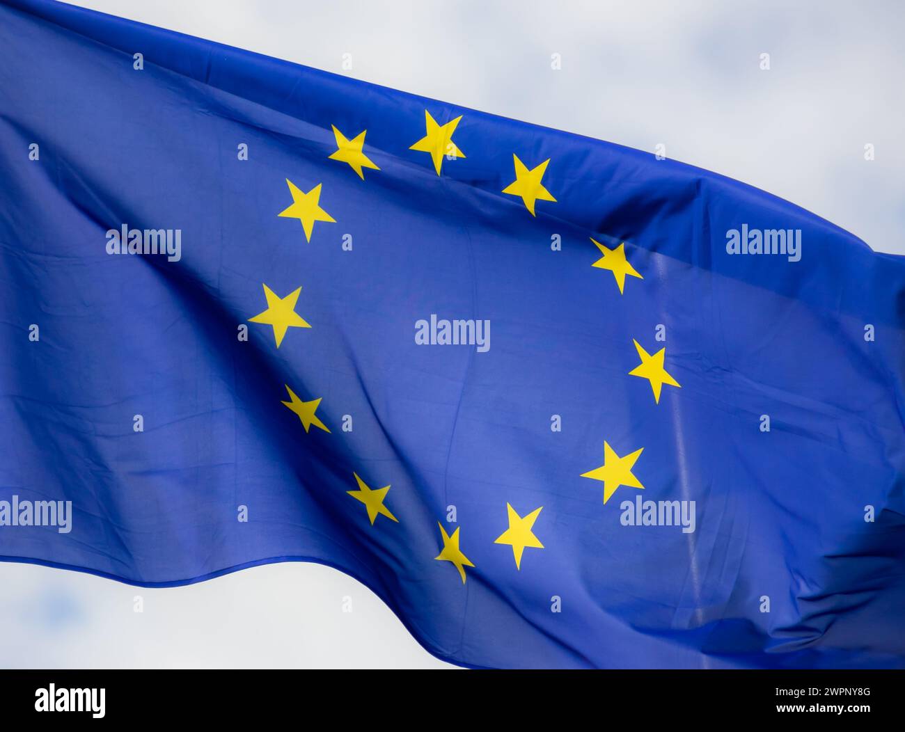Official flag of the European Union in front of a blue sky Stock Photo ...