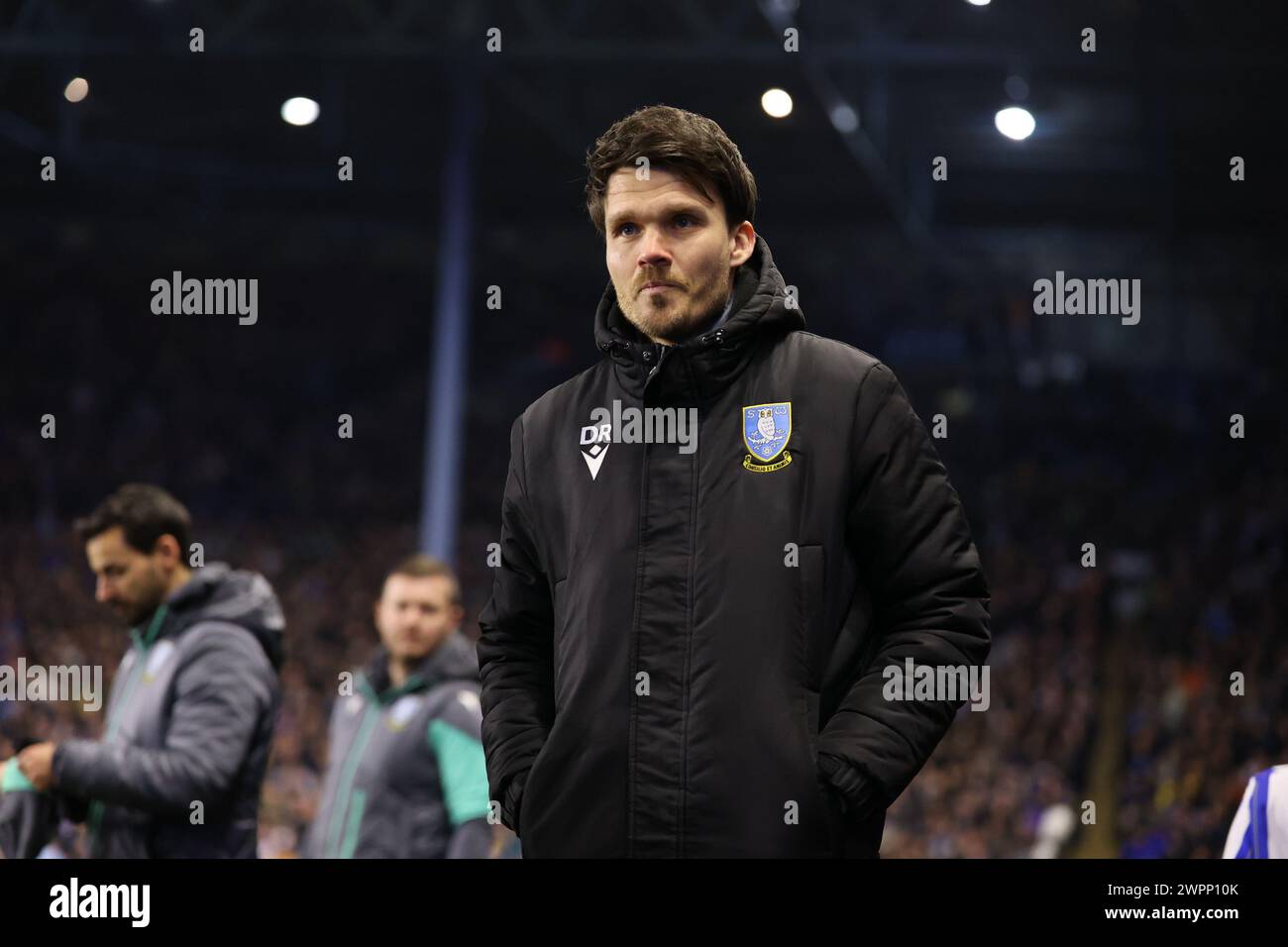 Danny Rohl, Sheffield Wednesday manager, takes his place in the dugout ...