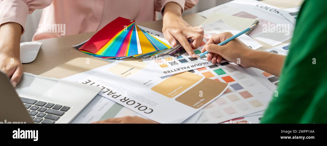 Cropped imaged of professional interior designers choose appropriate ...