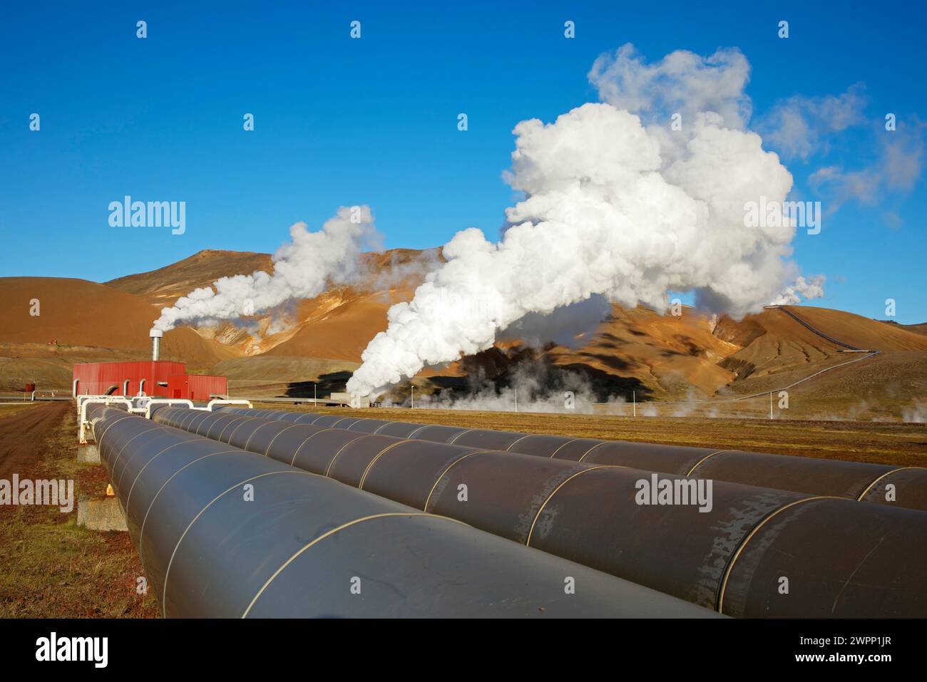 Pipe system and steam columns at the Kroefluvirkjun geothermal power ...
