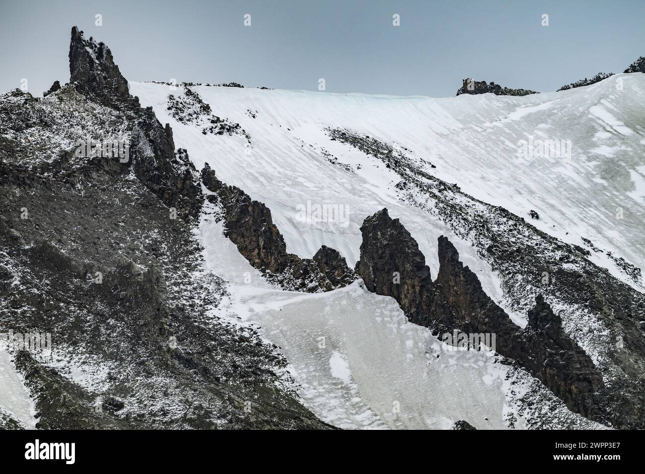 A vertical dike cutting throw surrounding rocks. Antarctica Stock Photo ...