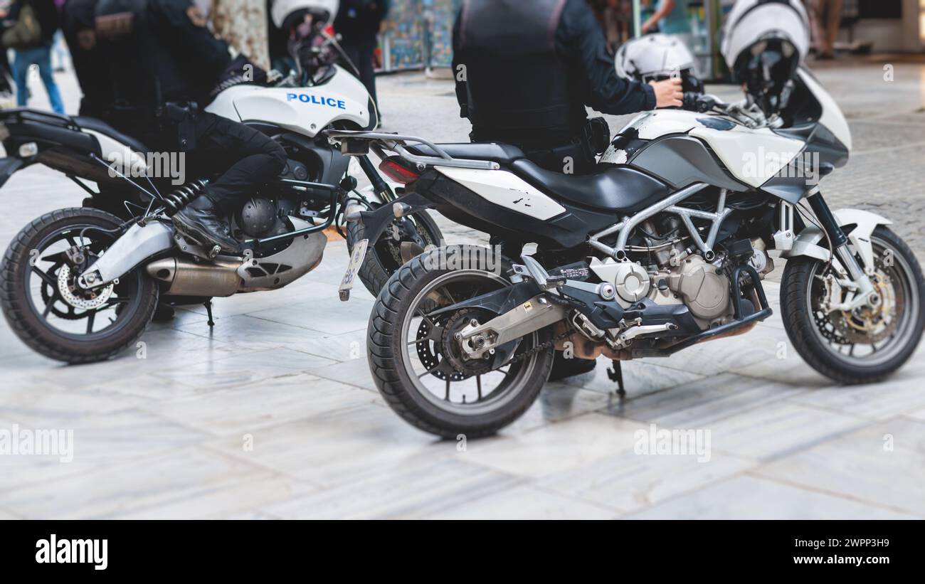 Hellenic Police, Greek police squad on duty riding bike and motorcycle ...