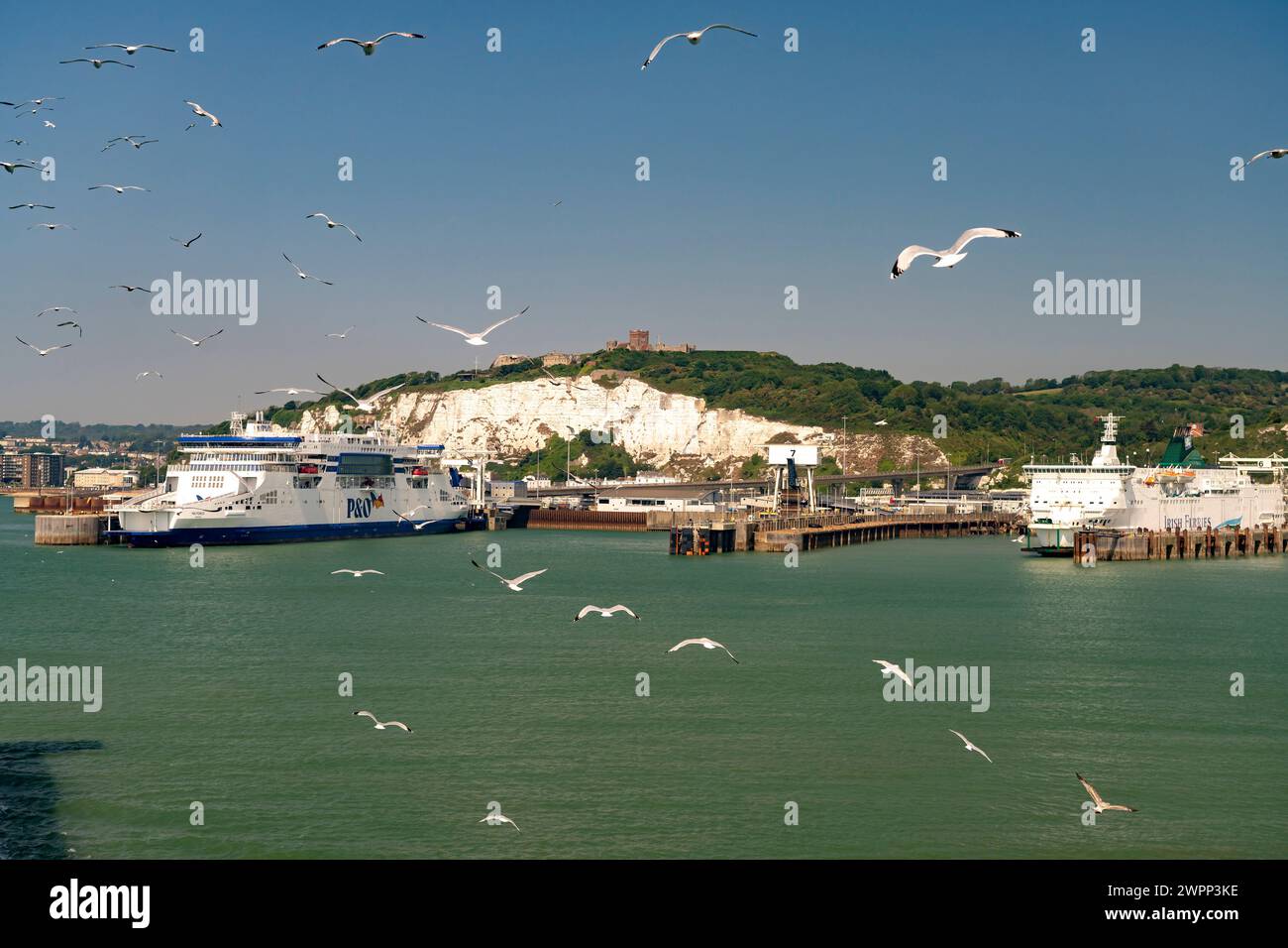 Ferries in the harbor, castle and the chalk cliffs of Dover, Kent ...