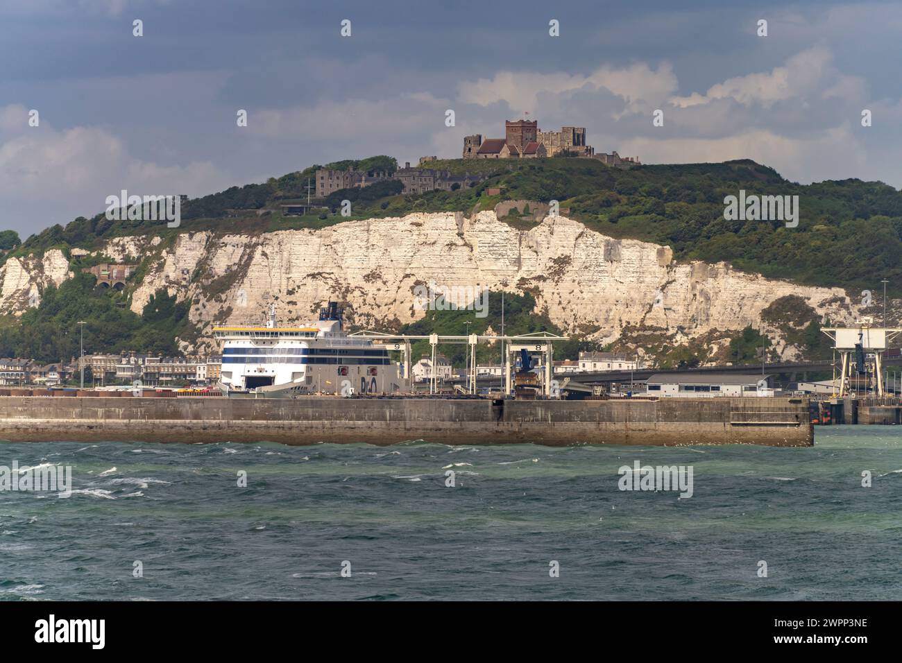 Ferries in the harbor, castle and the chalk cliffs of Dover, Kent ...