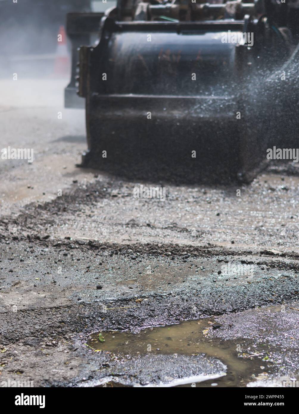 Process of asphalting, blacktopping and paving, asphalt paver machine ...