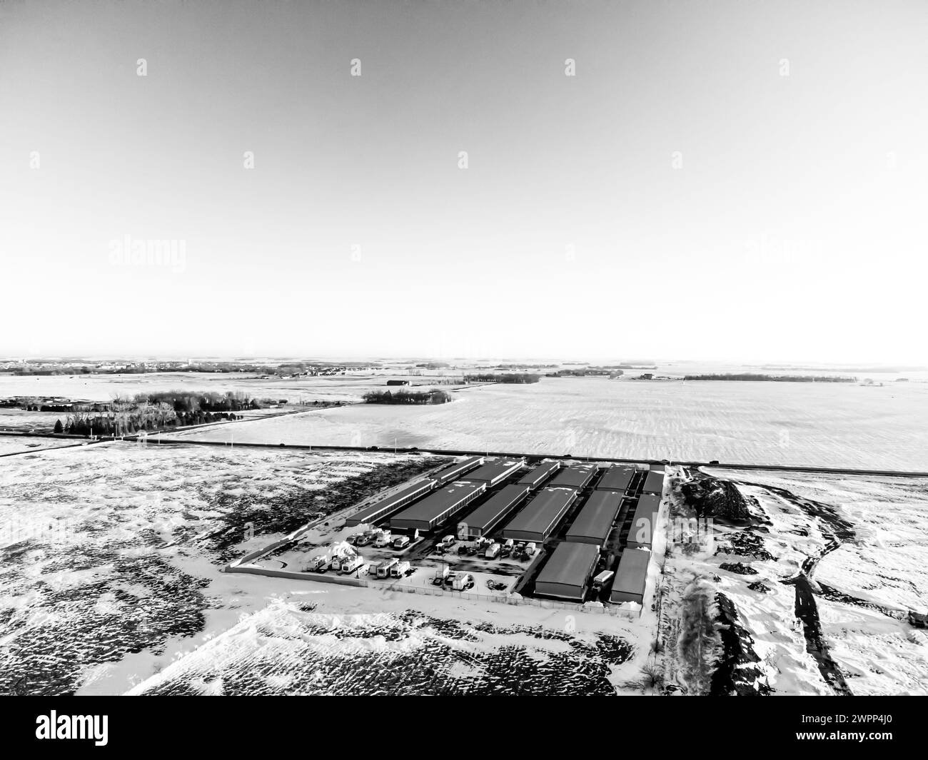 Drone view of a rental storage unit facility with closed bay doors ...