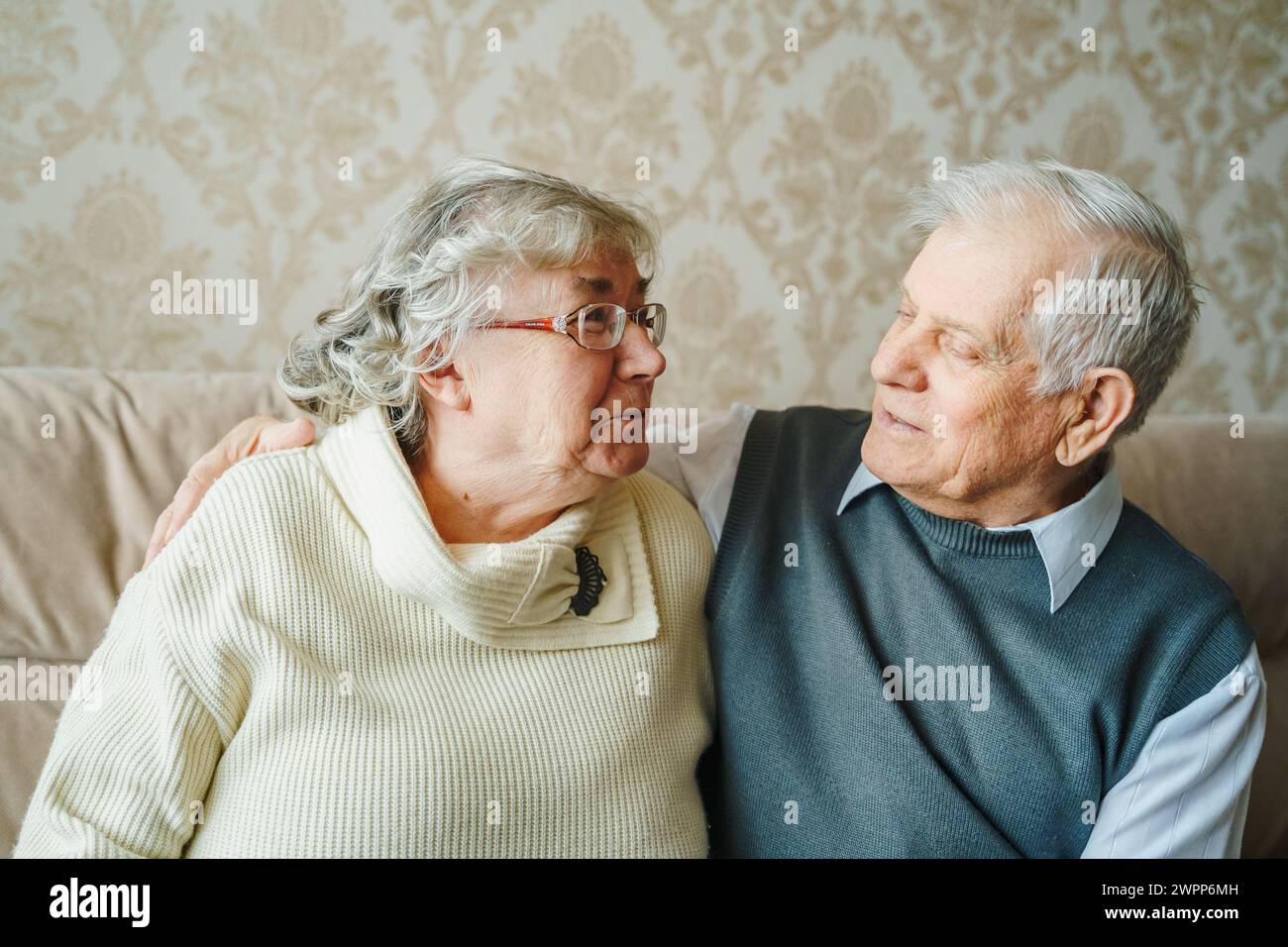 Older woman kissing husband hi-res stock photography and images - Alamy