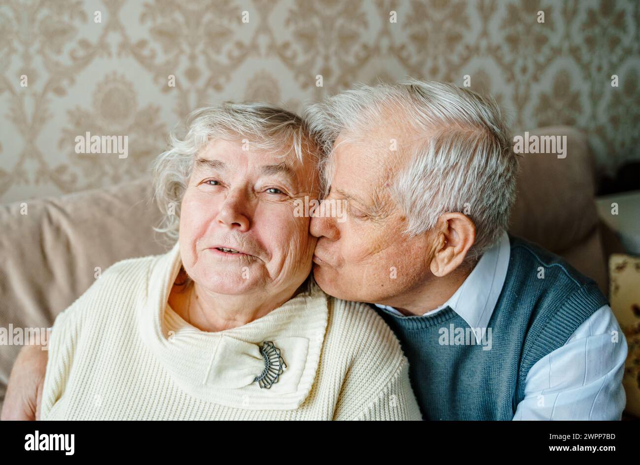Older woman kissing husband hi-res stock photography and images - Alamy