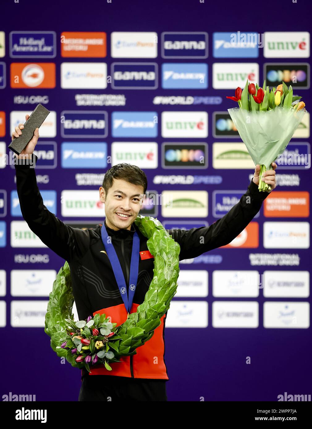 INZELL - Zhongyan Ning (CHN) with his gold medal on the podium after ...
