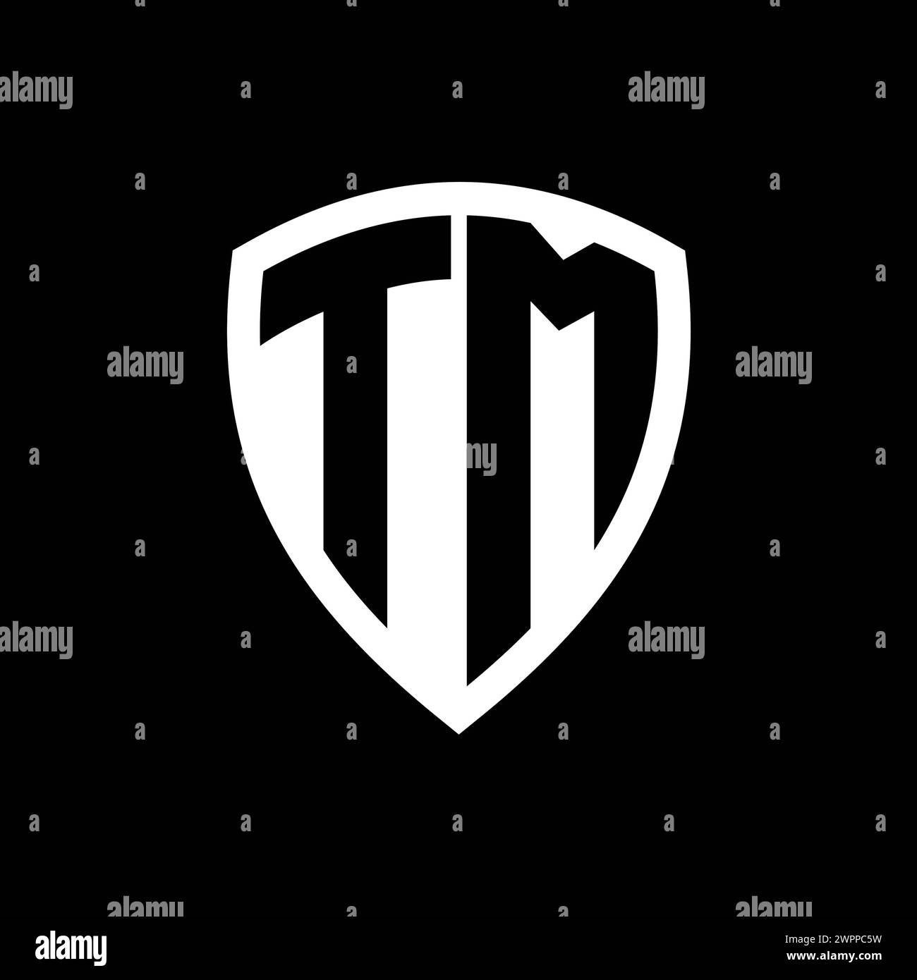 TM monogram logo with bold letters shield shape with black and white ...