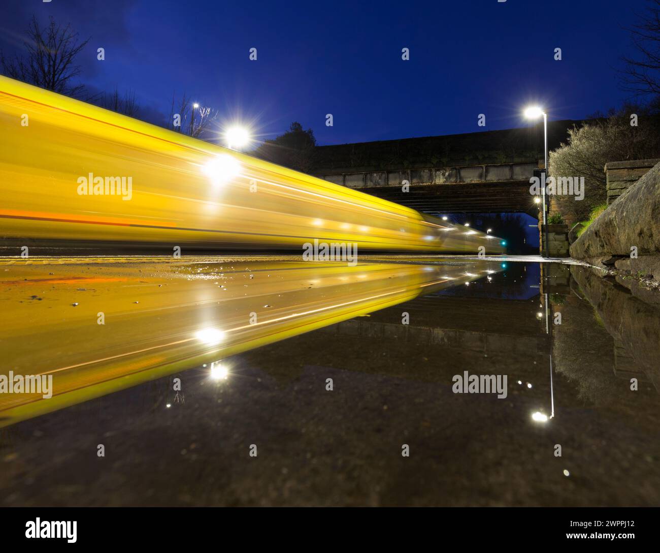 Merseyrail train arriving at Wallasey Grove Road station at night ...