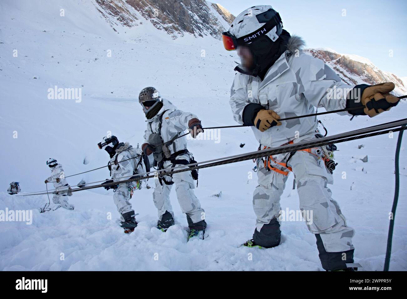 Members of the U.S. Special Operations Mountain Warfare Training Center (SOMWTC) and Danish ...