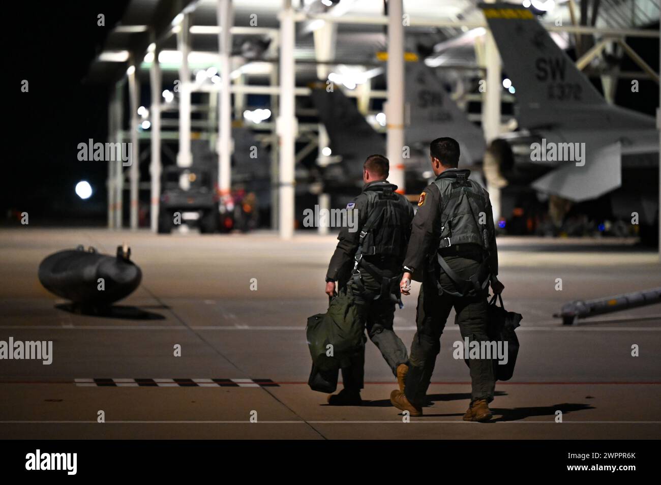 U.S. Air Force 20th Fighter Wing pilots step to their assigned F-16C ...