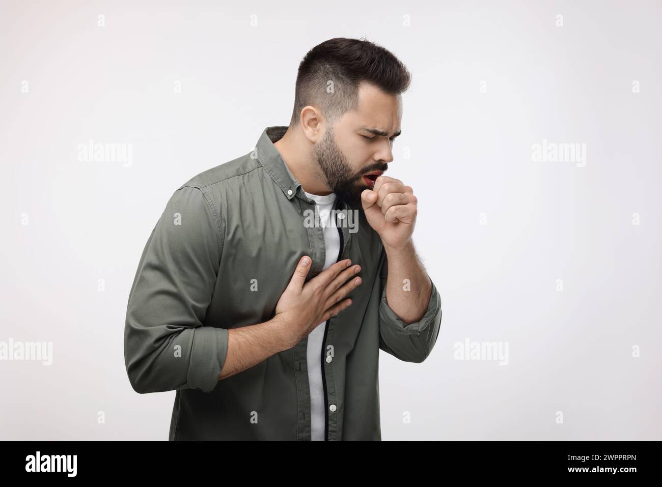 Sick man coughing on white background. Cold symptoms Stock Photo - Alamy