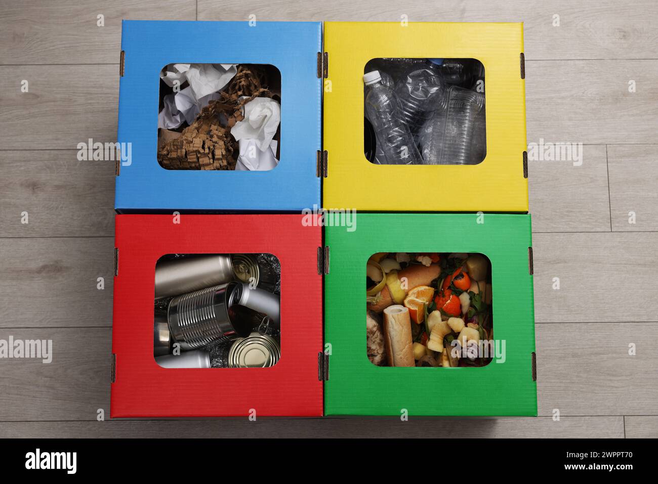 Garbage sorting. Full trash bins for separate waste collection indoors ...