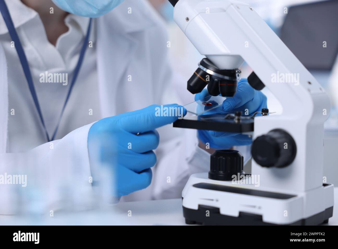 Scientist working with microscope in laboratory, closeup Stock Photo ...