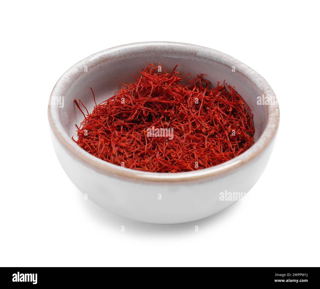 Aromatic saffron in bowl isolated on white Stock Photo - Alamy