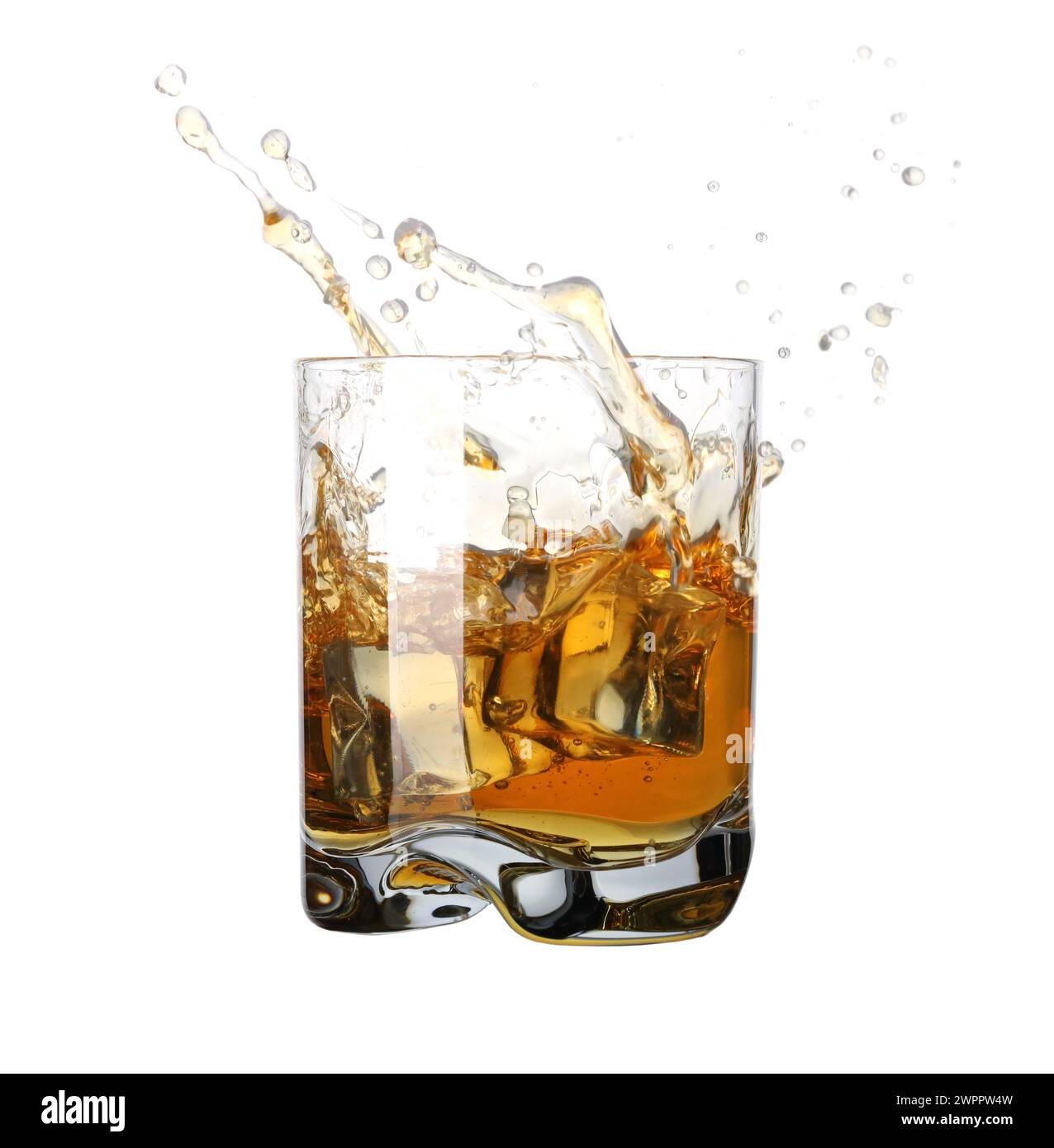 Whiskey splashing out of glass on white background Stock Photo - Alamy