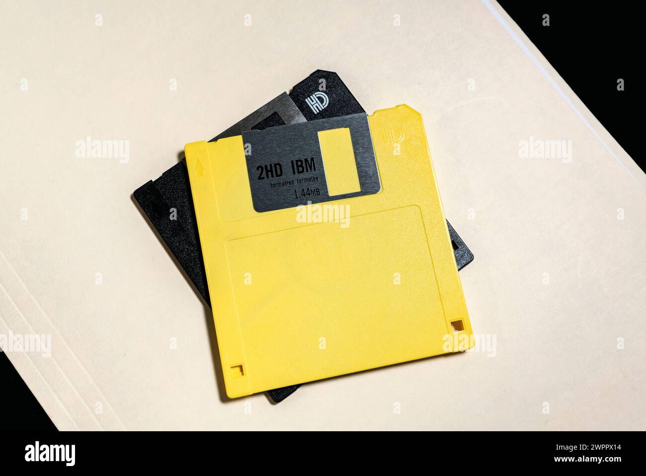 Old 3 and a half inch floppy disks on a manila folder Stock Photo - Alamy