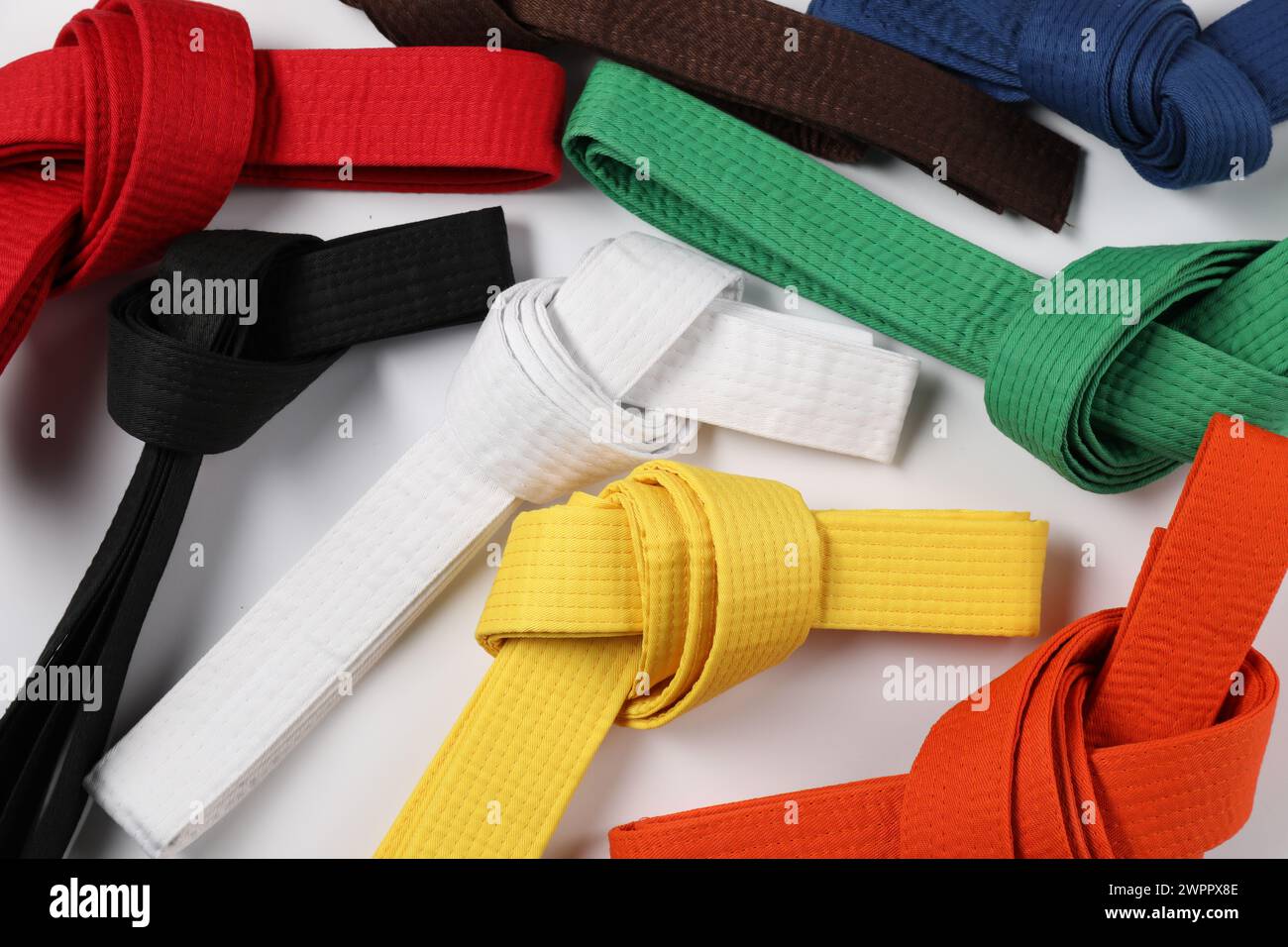 Colorful karate belts on white background, flat lay Stock Photo - Alamy
