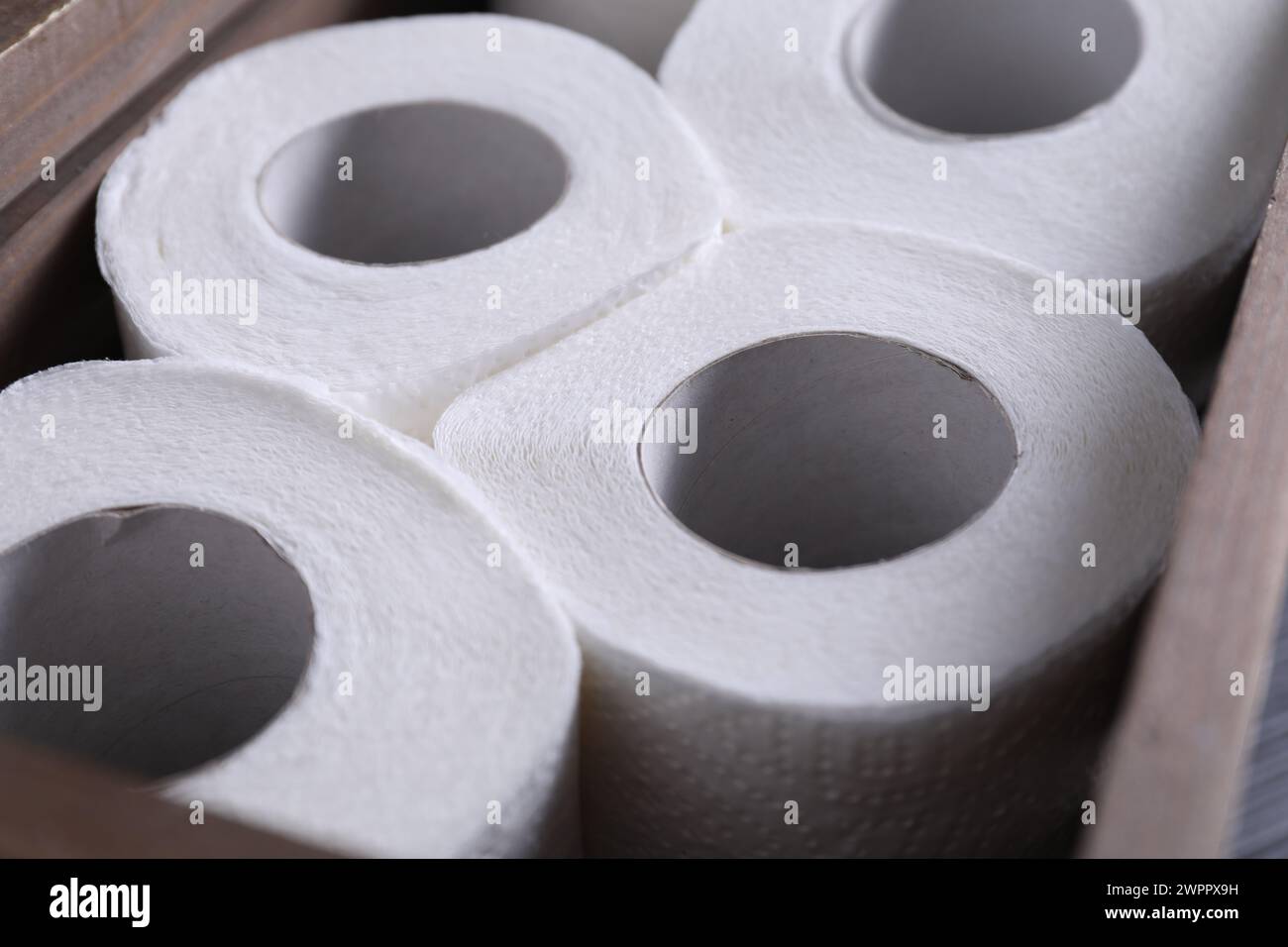 Many toilet paper rolls in crate, closeup Stock Photo - Alamy