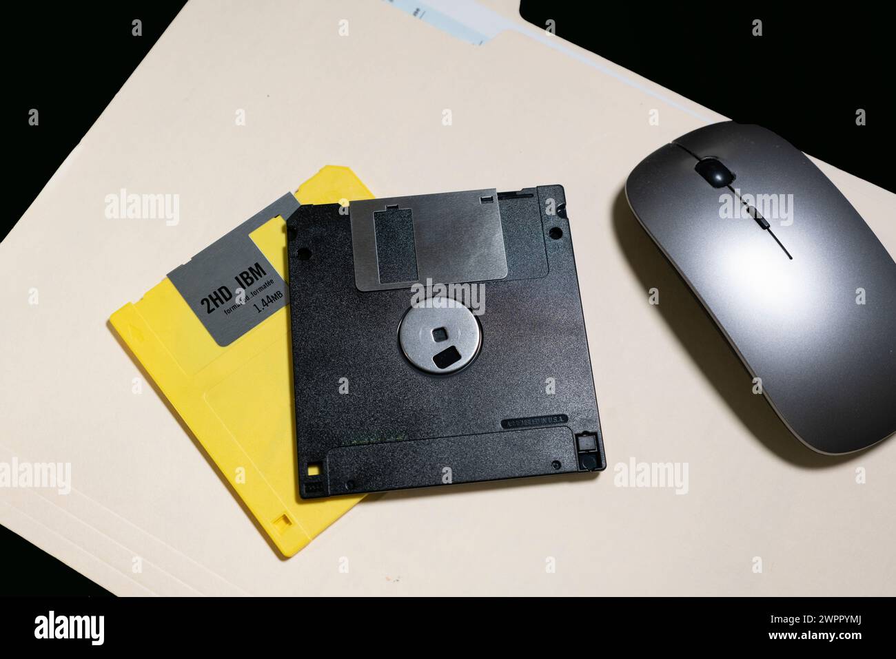 Old 3 and a half inch floppy disks on a manila folder Stock Photo - Alamy