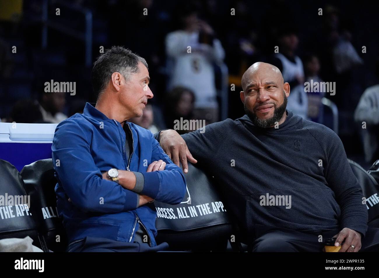 Los Angeles general manager Rob Pelinka, left, talks with head coach ...
