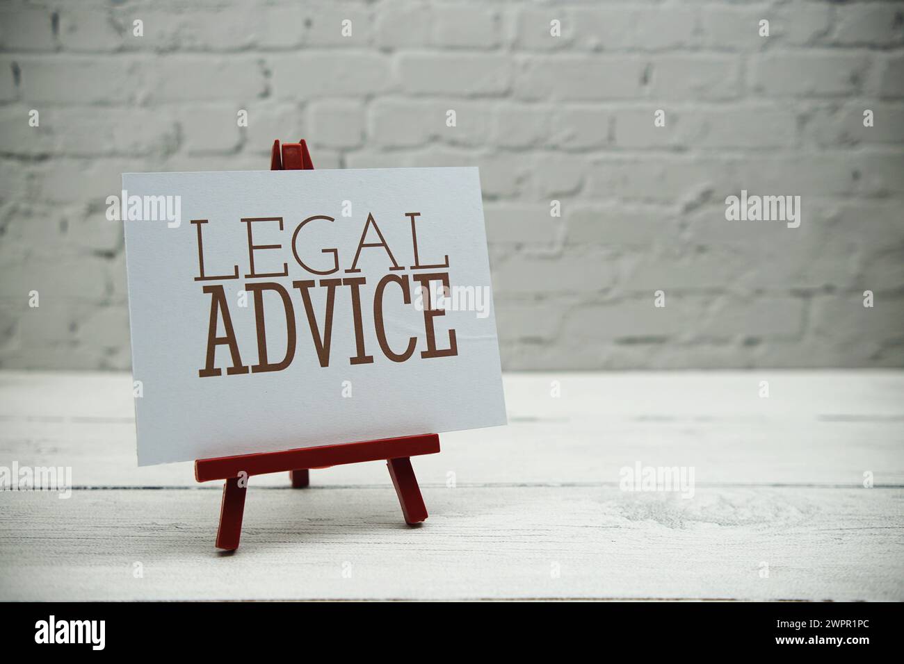 Legal Advice text on white brick wall and wooden background Stock Photo ...