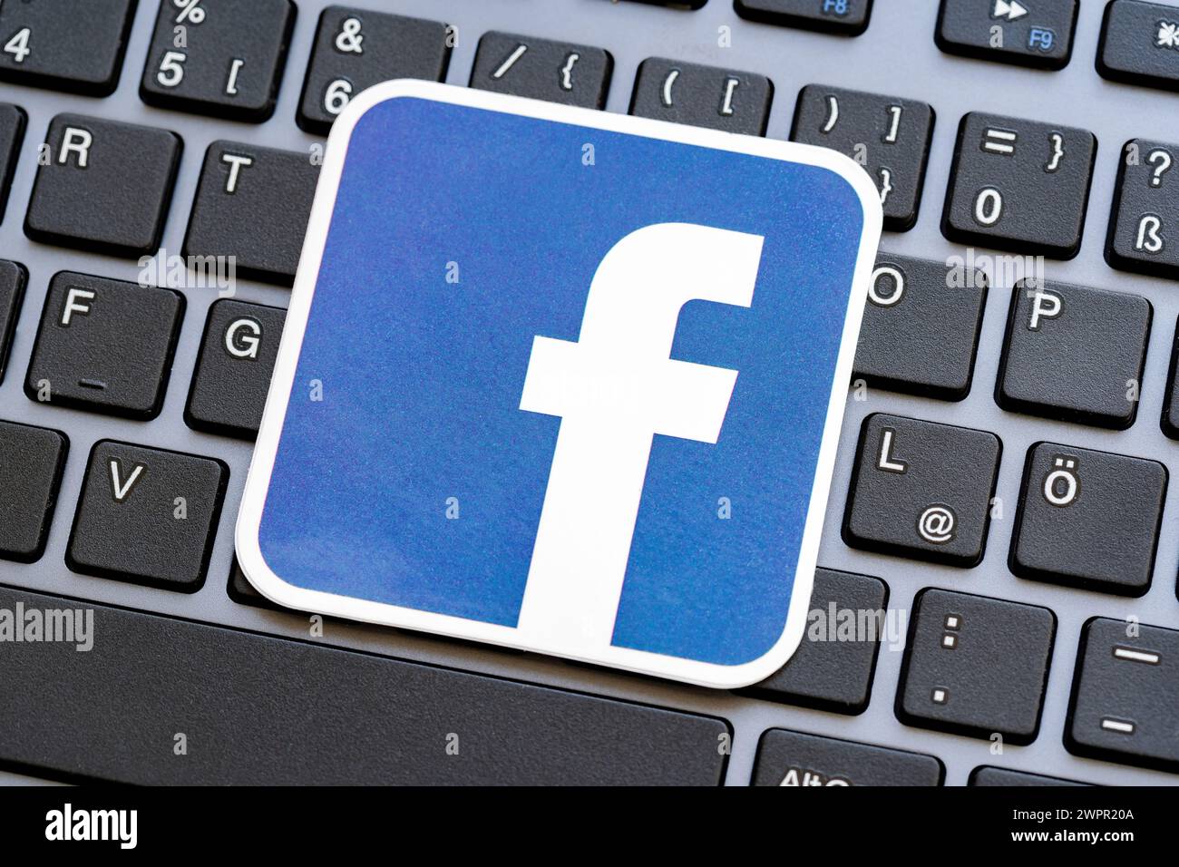 Close-up shot of the Meta Facebook logo symbol on a desktop PC computer ...