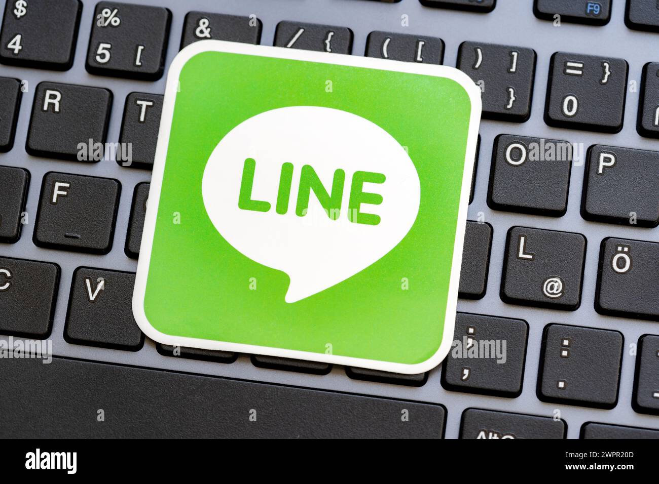LINE communication app logo icon on a computer keyboard, instant ...