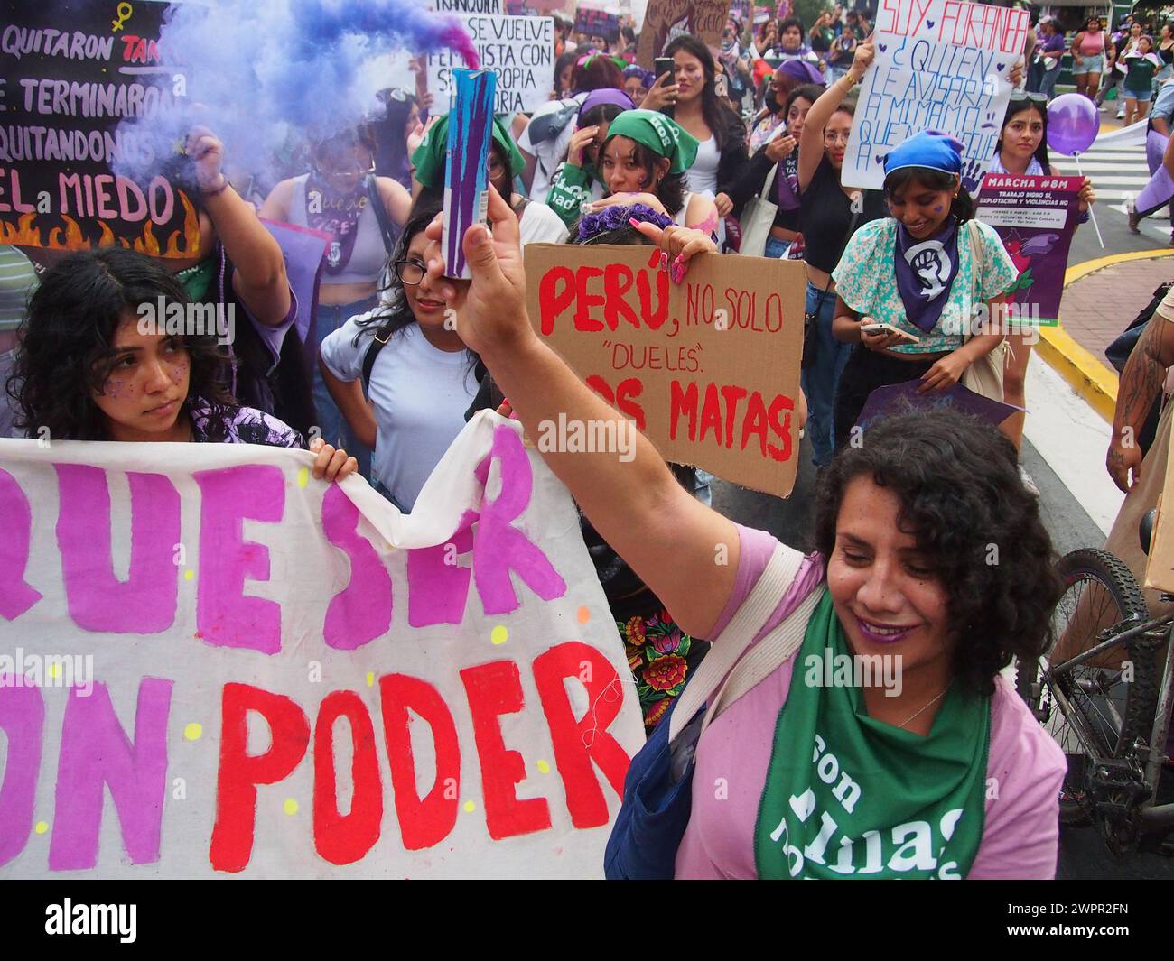 Lima, Peru. 08th Mar, 2024. An activist waving a smoke flare when ...