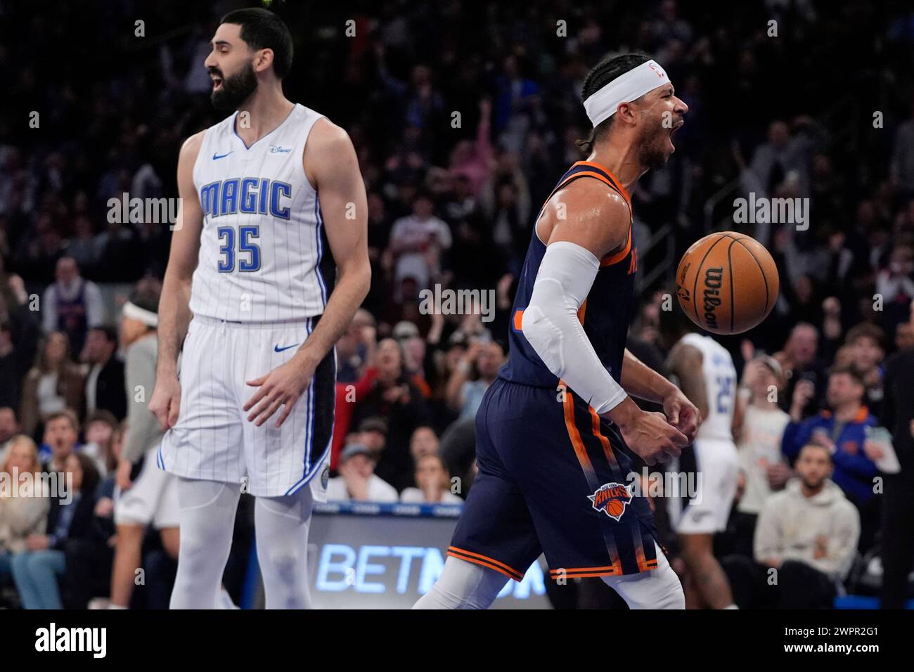 New York Knicks' Josh Hart, right, celebrates after dunking in front of ...