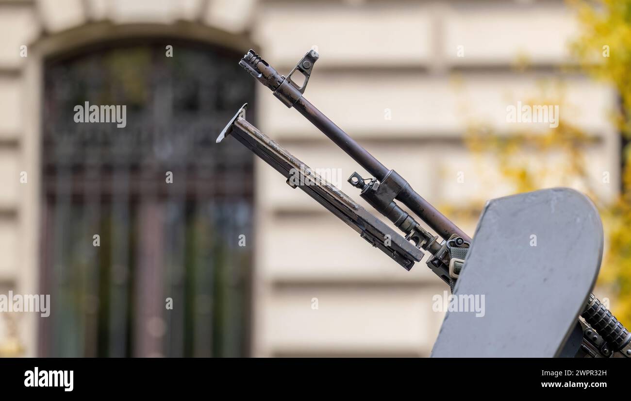 Gun barrel closeup detail, weapon mounted on top of an armored military ...