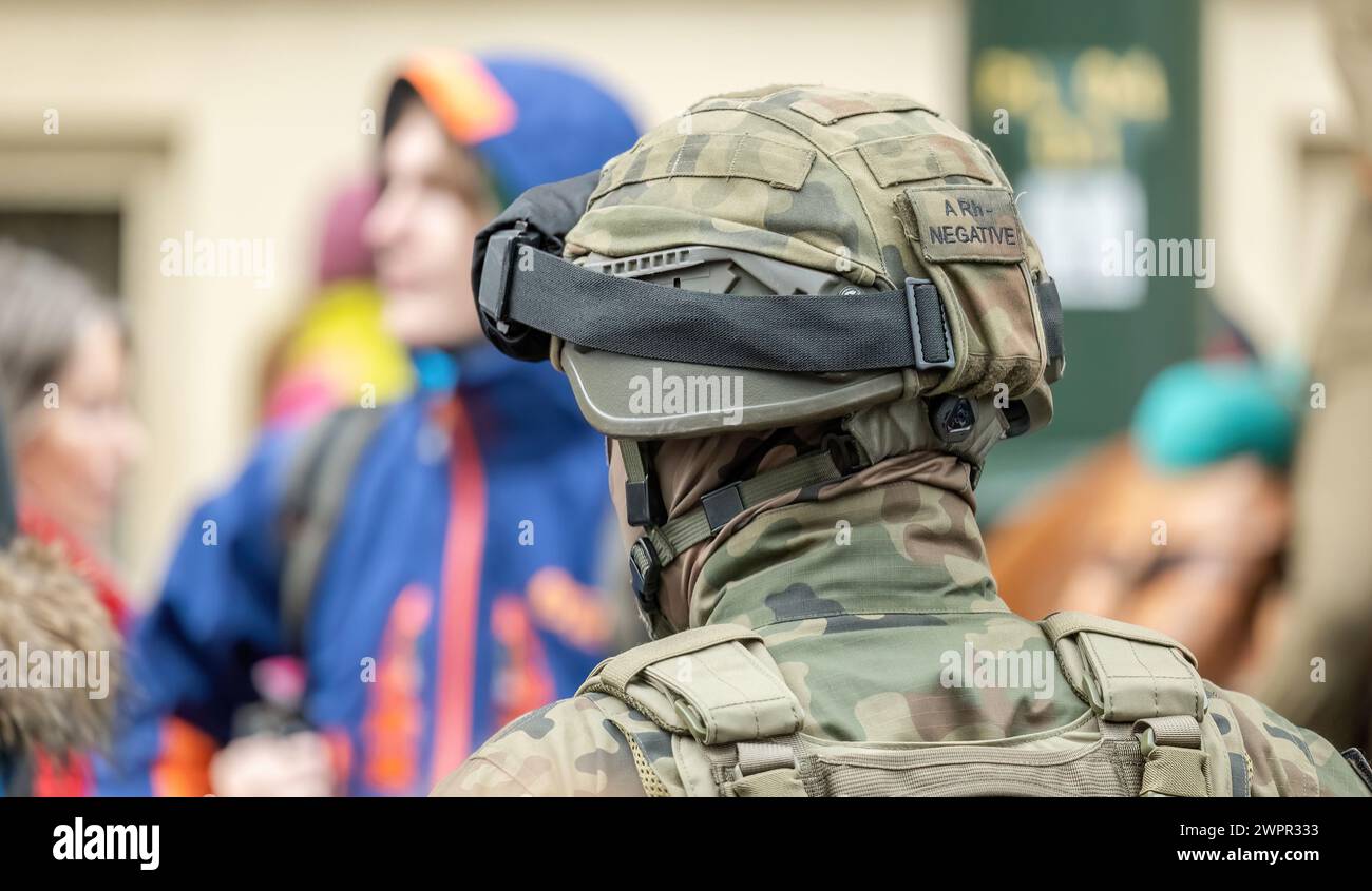 A soldier wearing a generic camo helmet uniform and combat gear is seen ...